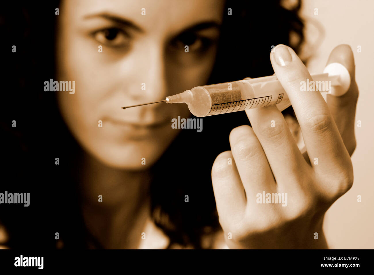 Portrait of a young doctor with syringe Stock Photo - Alamy
