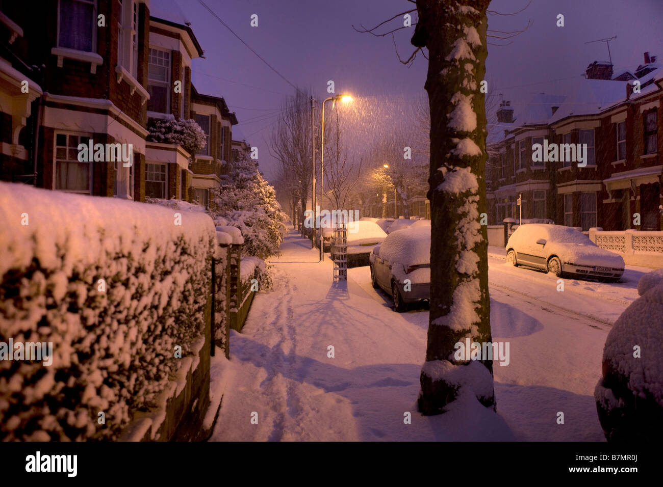 Snowing in a London street at night Stock Photo - Alamy