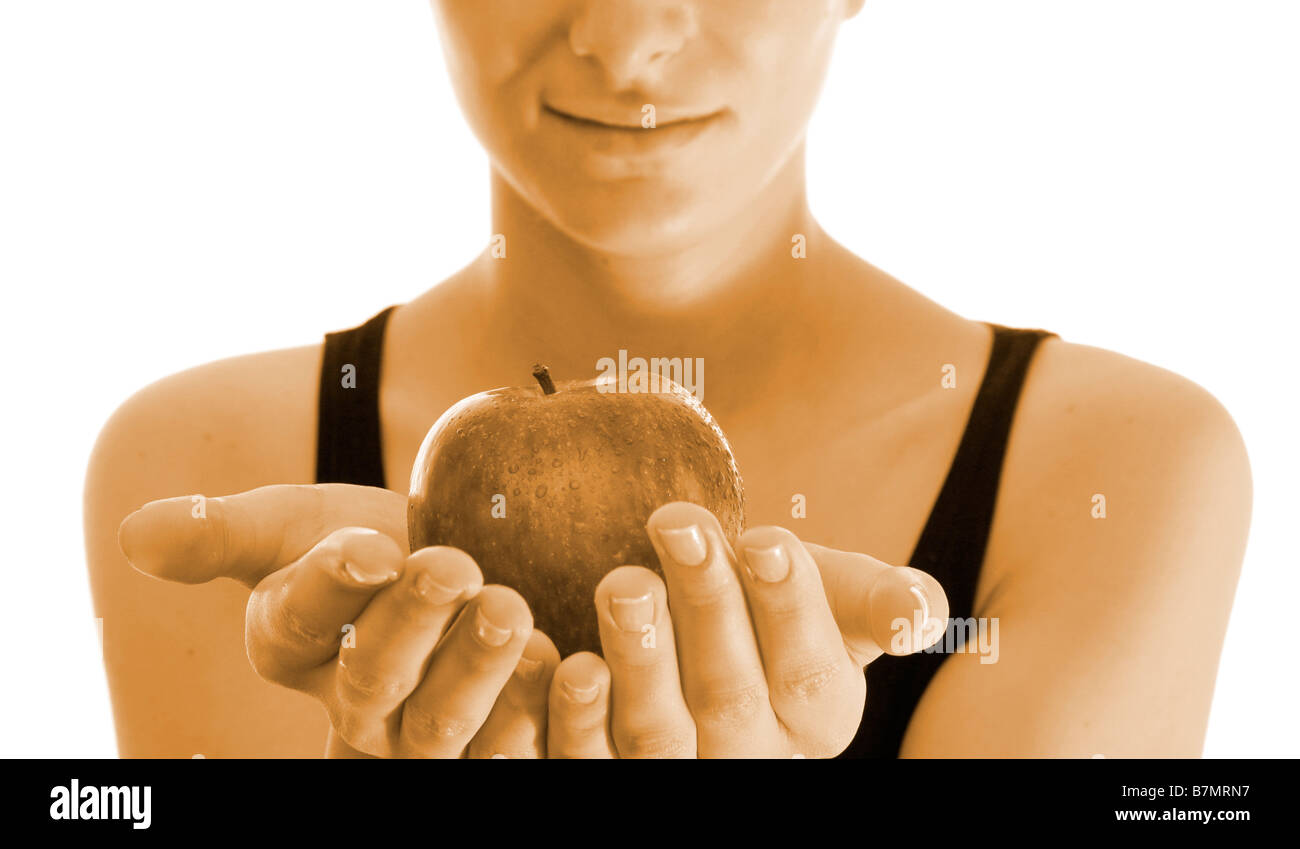 Beautiful young woman eating red apple over white Stock Photo - Alamy