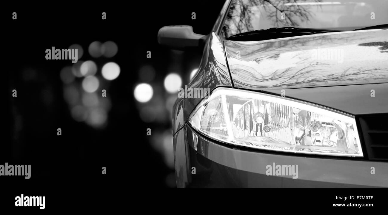 Red car in traffic at night Stock Photo - Alamy