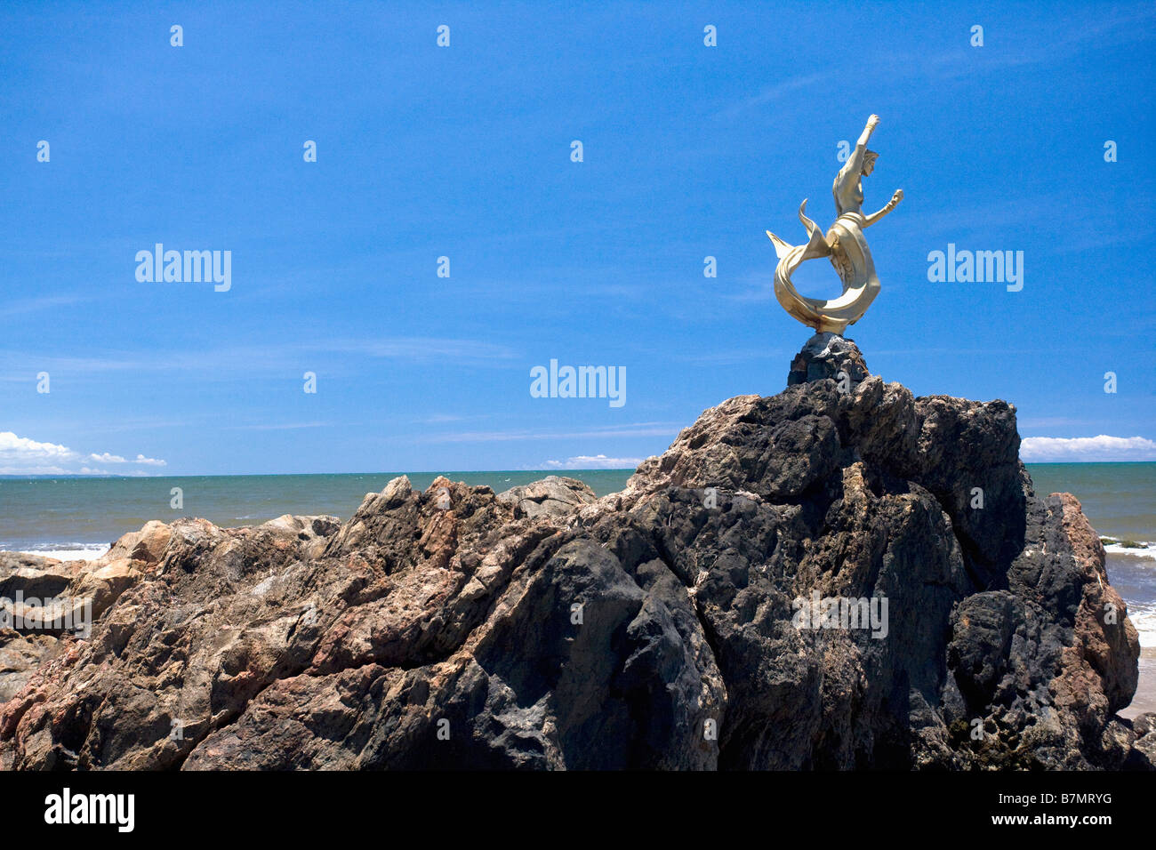 Modern statue on rock on coastline in Brazil Stock Photo - Alamy