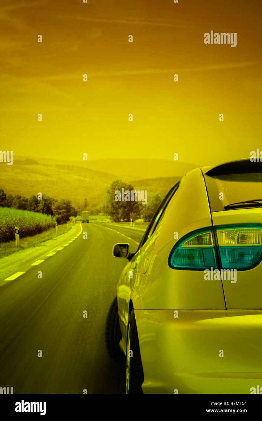 Car on the road view from the back Stock Photo - Alamy