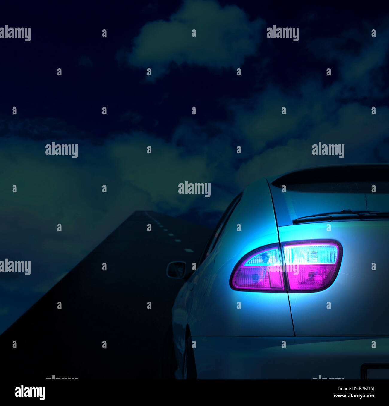 Car on the road view from the back Stock Photo - Alamy