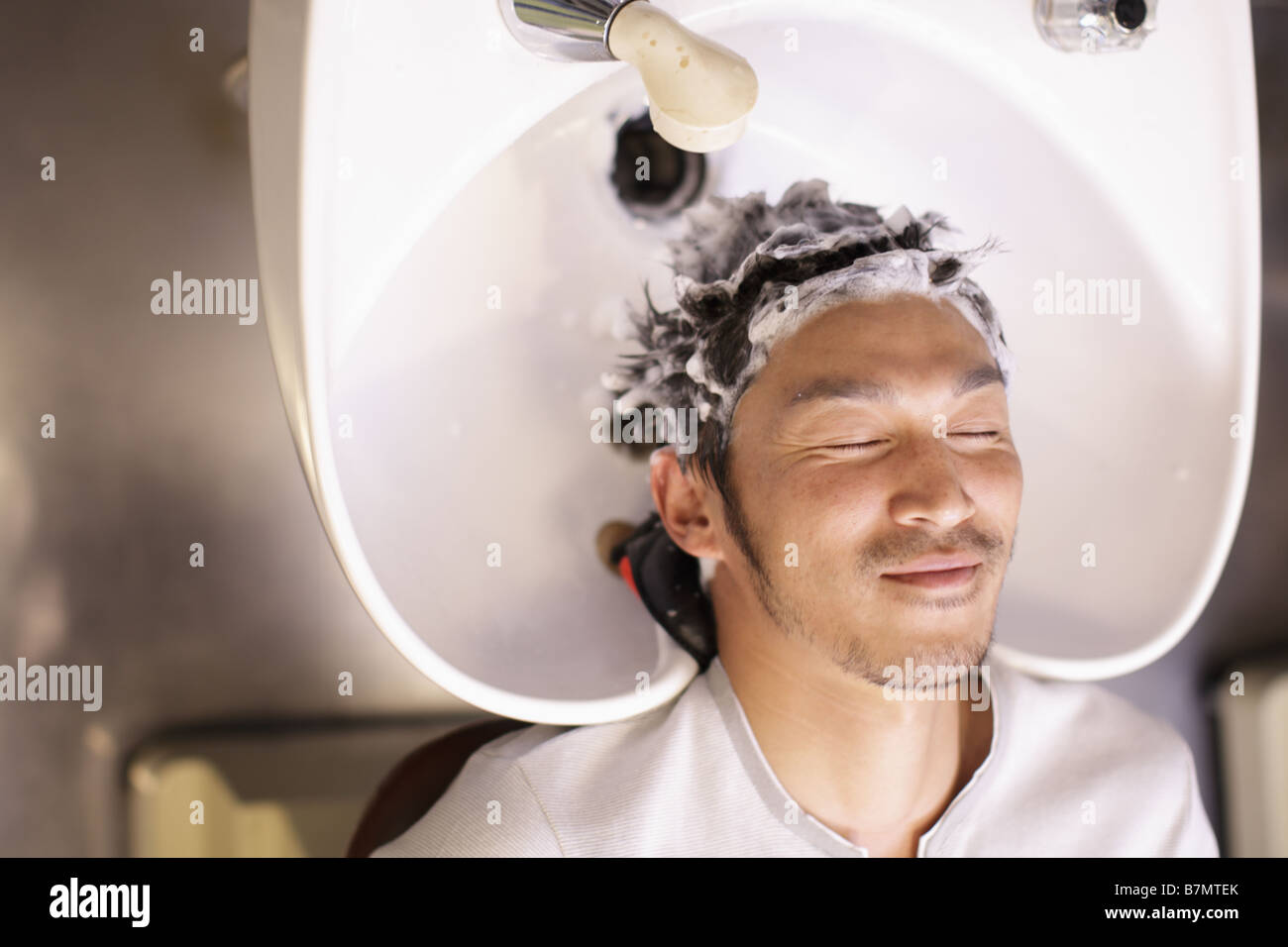 Man having hair washed shampoo hi-res stock photography and images - Alamy