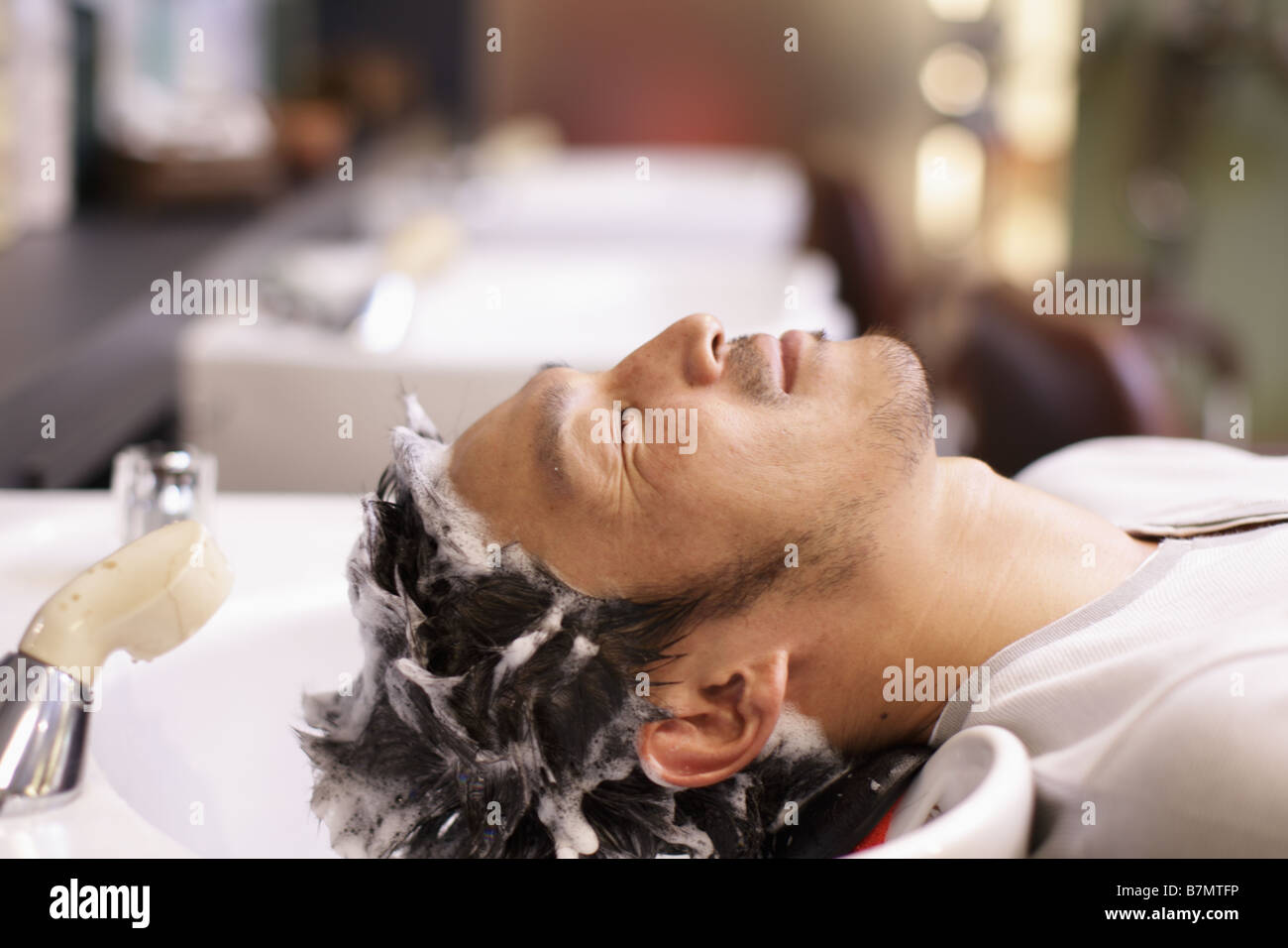 Man Having Hair Washed Stock Photo - Alamy
