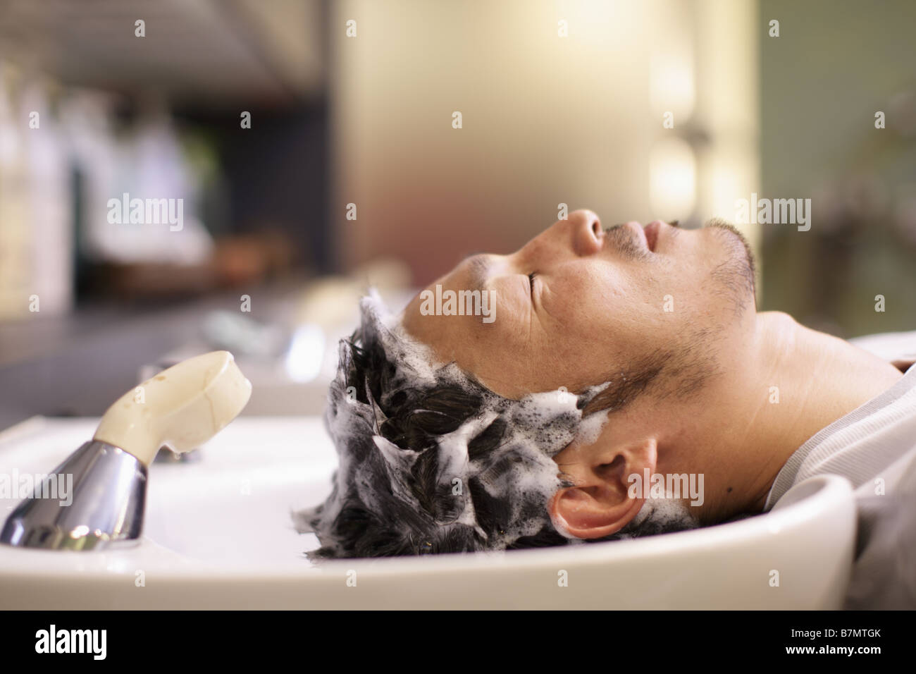Man Having Hair Washed Stock Photo - Alamy