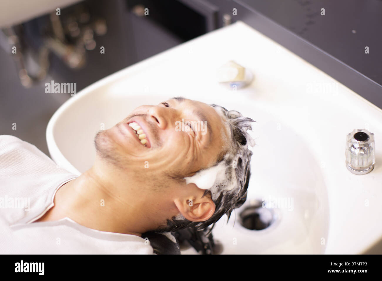 Man Having Hair Washed Stock Photo - Alamy