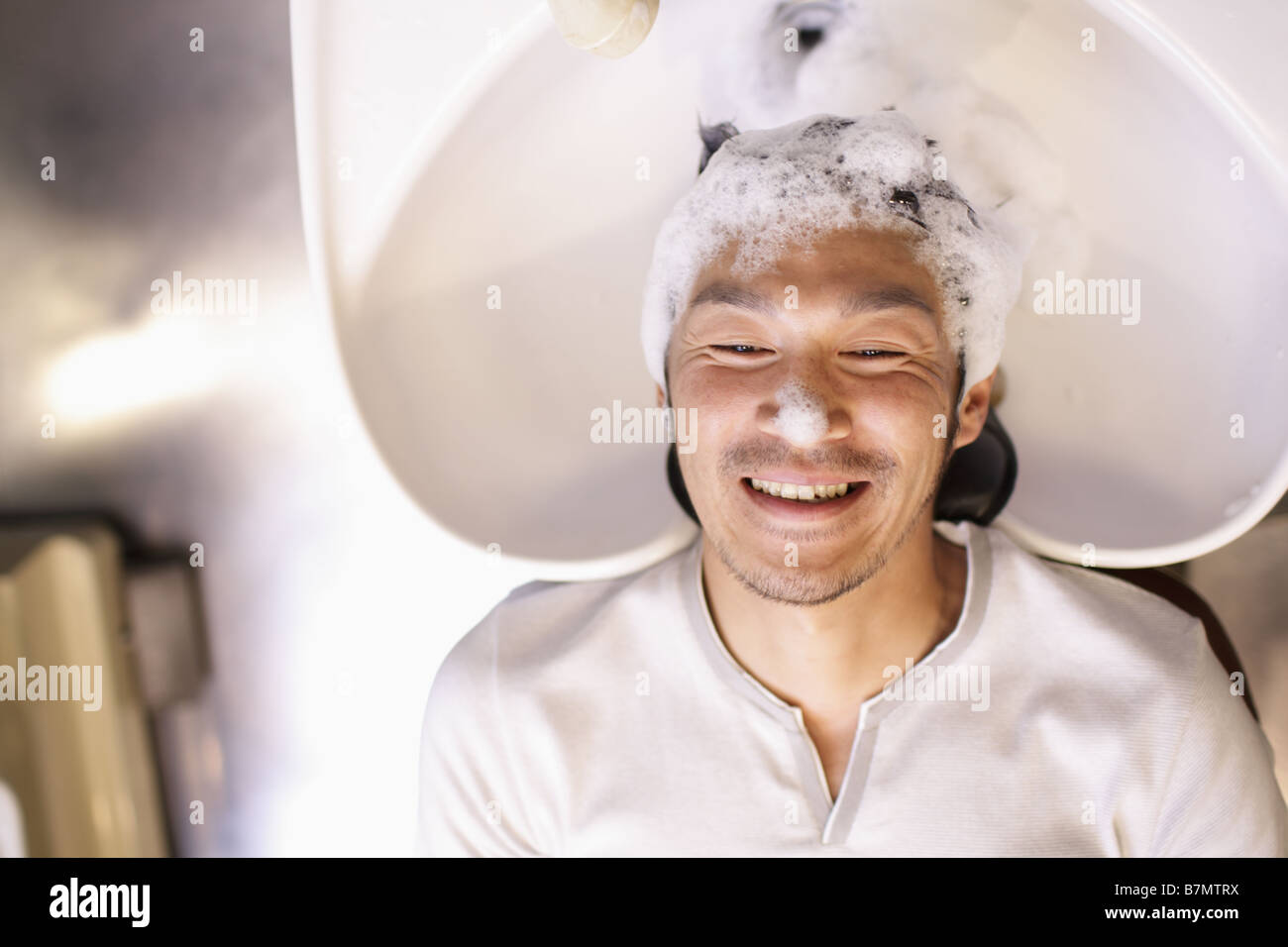 Man Having Hair Washed Stock Photo - Alamy