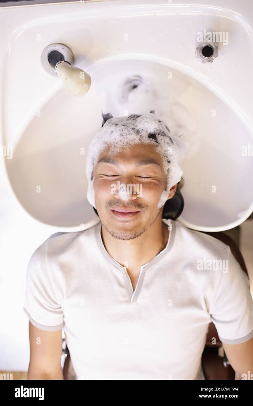 Man Having Hair Washed Stock Photo - Alamy