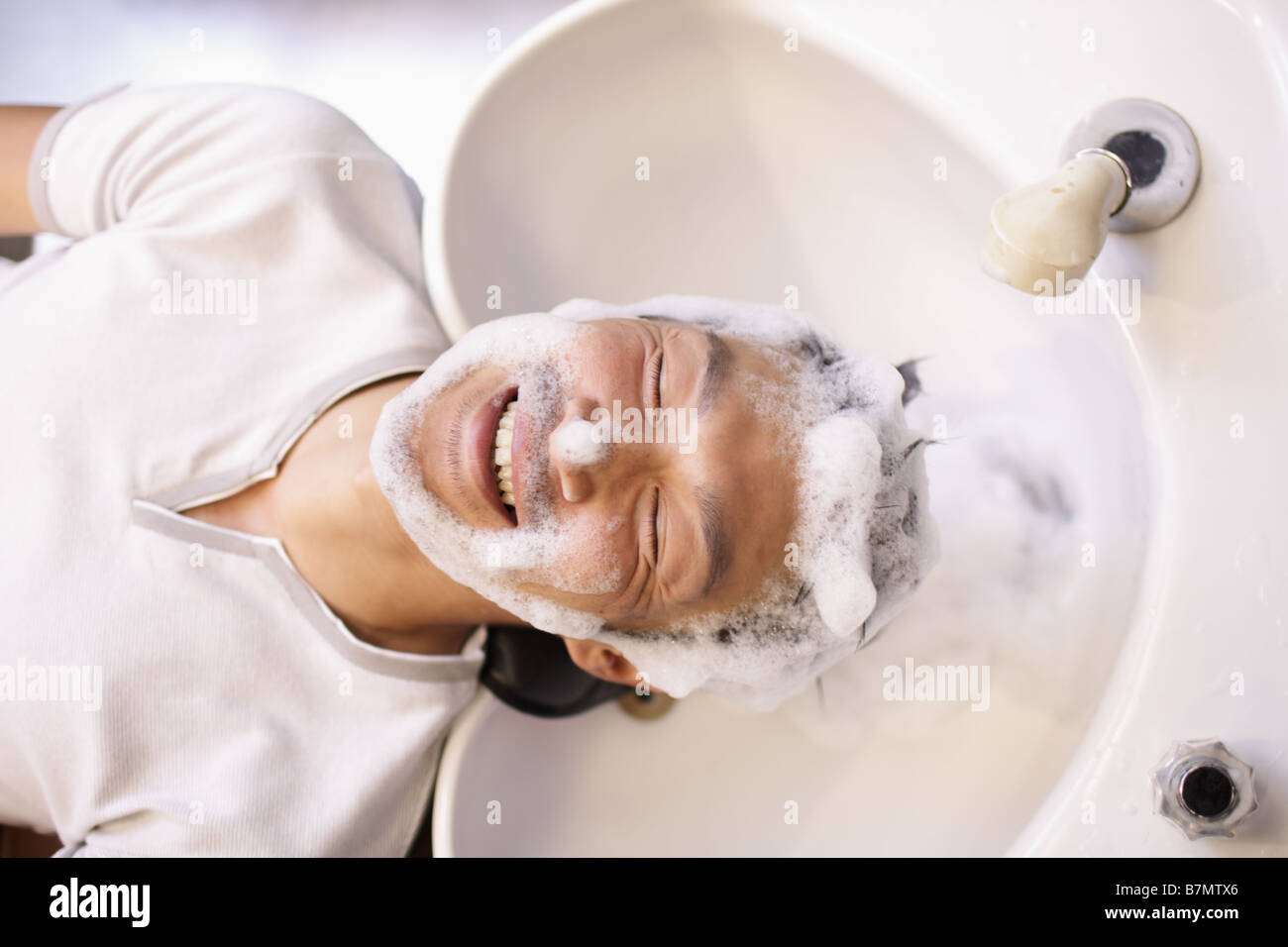 Man Having Hair Washed Stock Photo - Alamy
