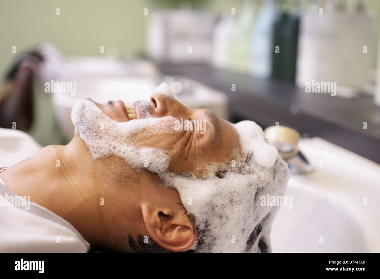 Man Having Hair Washed Stock Photo - Alamy