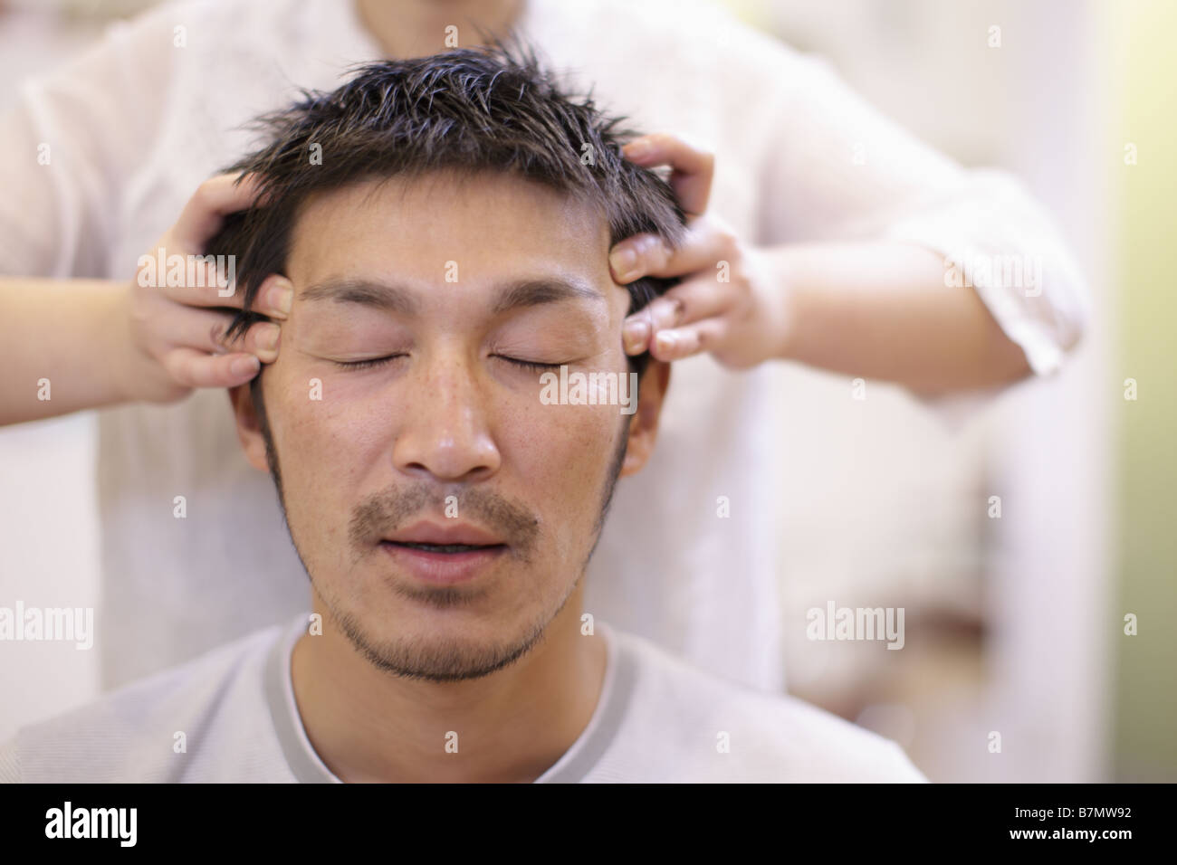 Man having a head massag Stock Photo - Alamy