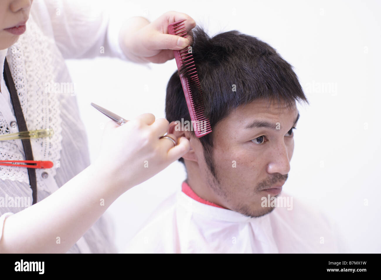 Man getting a hair cut hi-res stock photography and images - Alamy