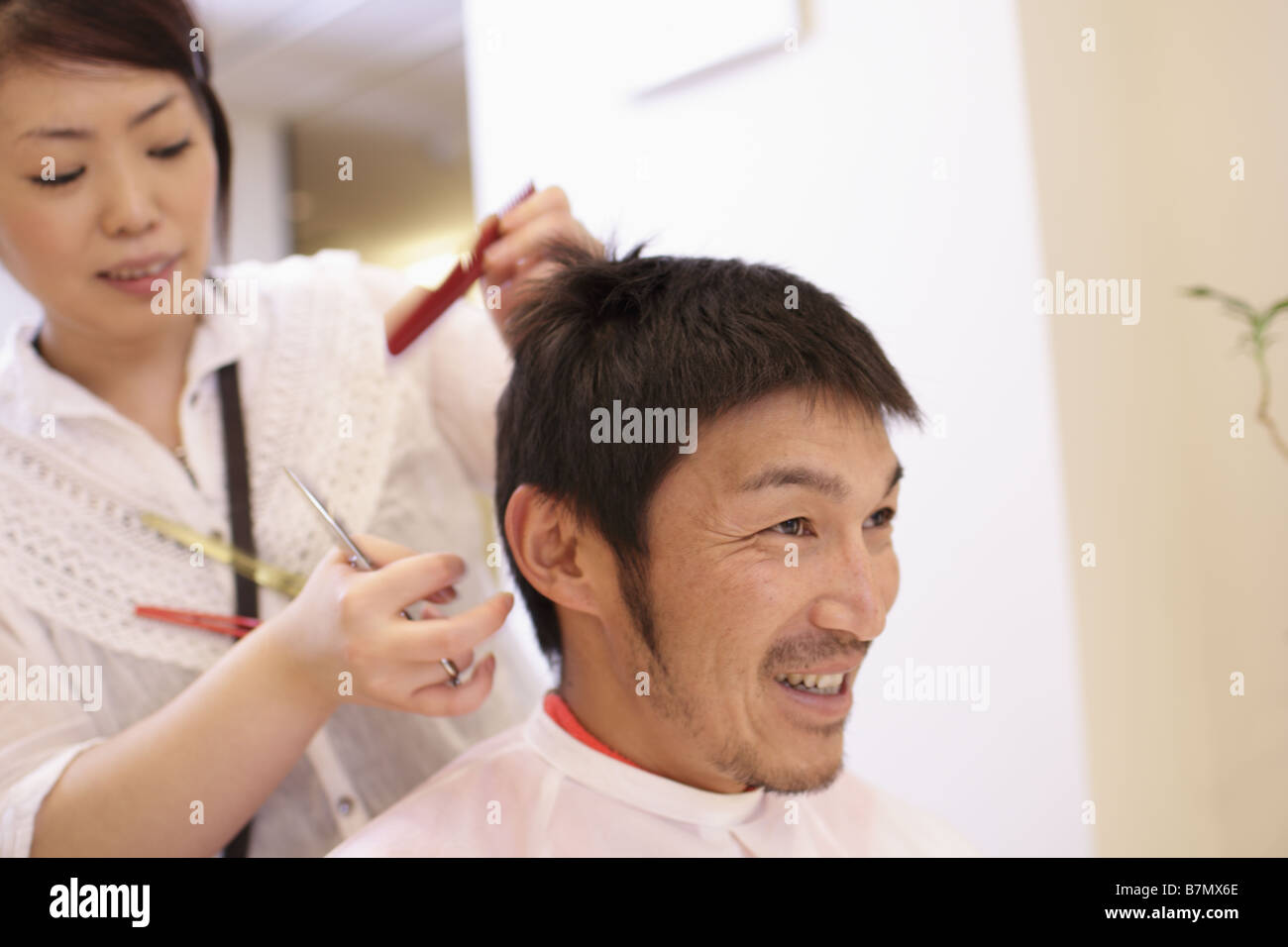 Man Getting Haircut in Salon Stock Photo - Alamy