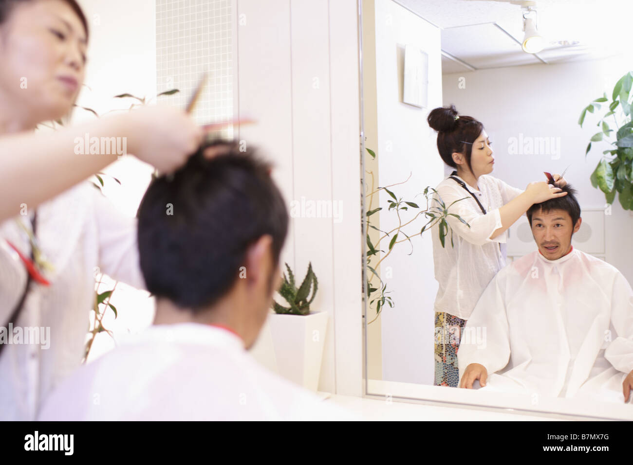 Man Getting Haircut in Salon Stock Photo - Alamy