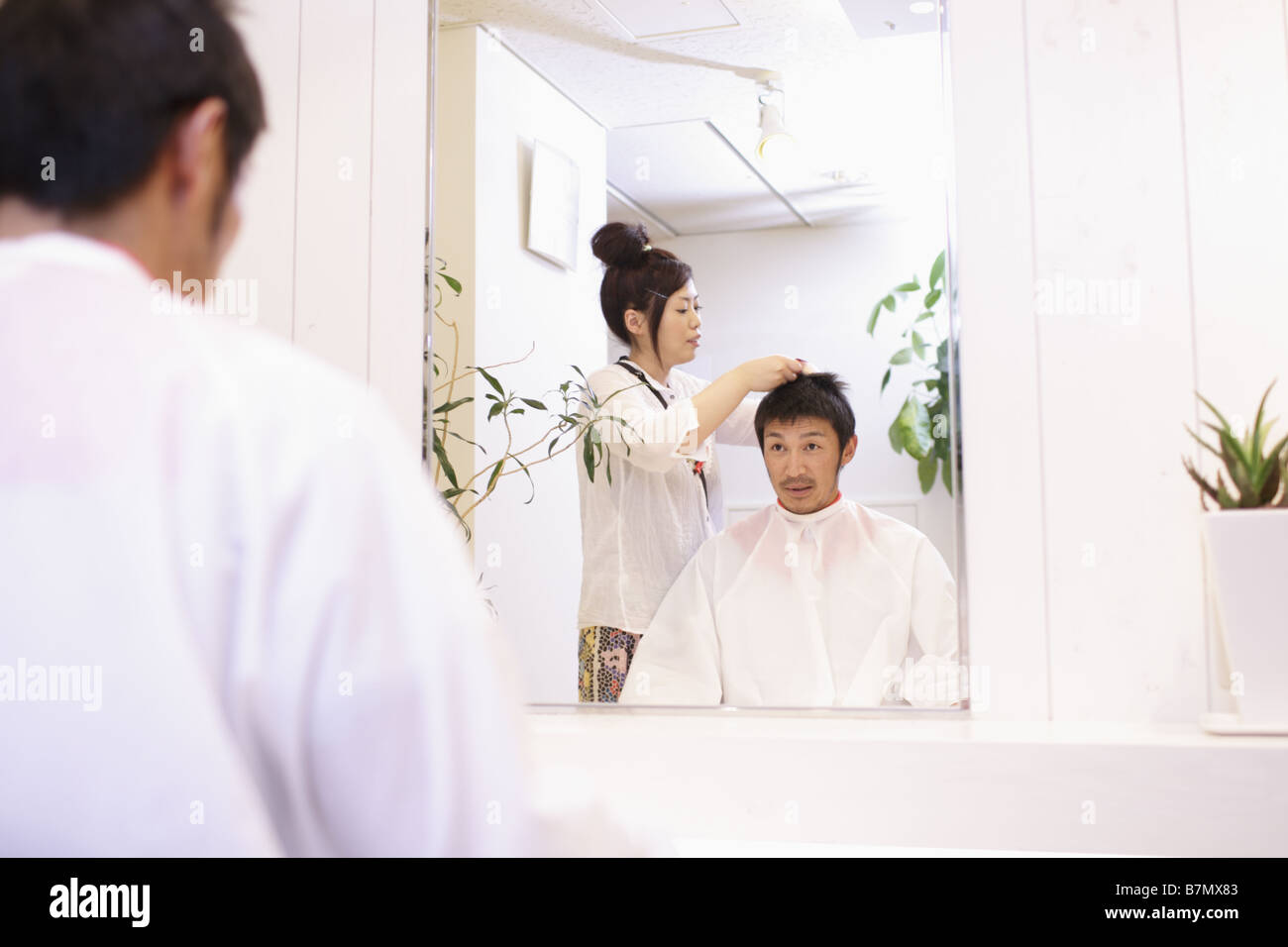 Man Getting Haircut in Salon Stock Photo - Alamy