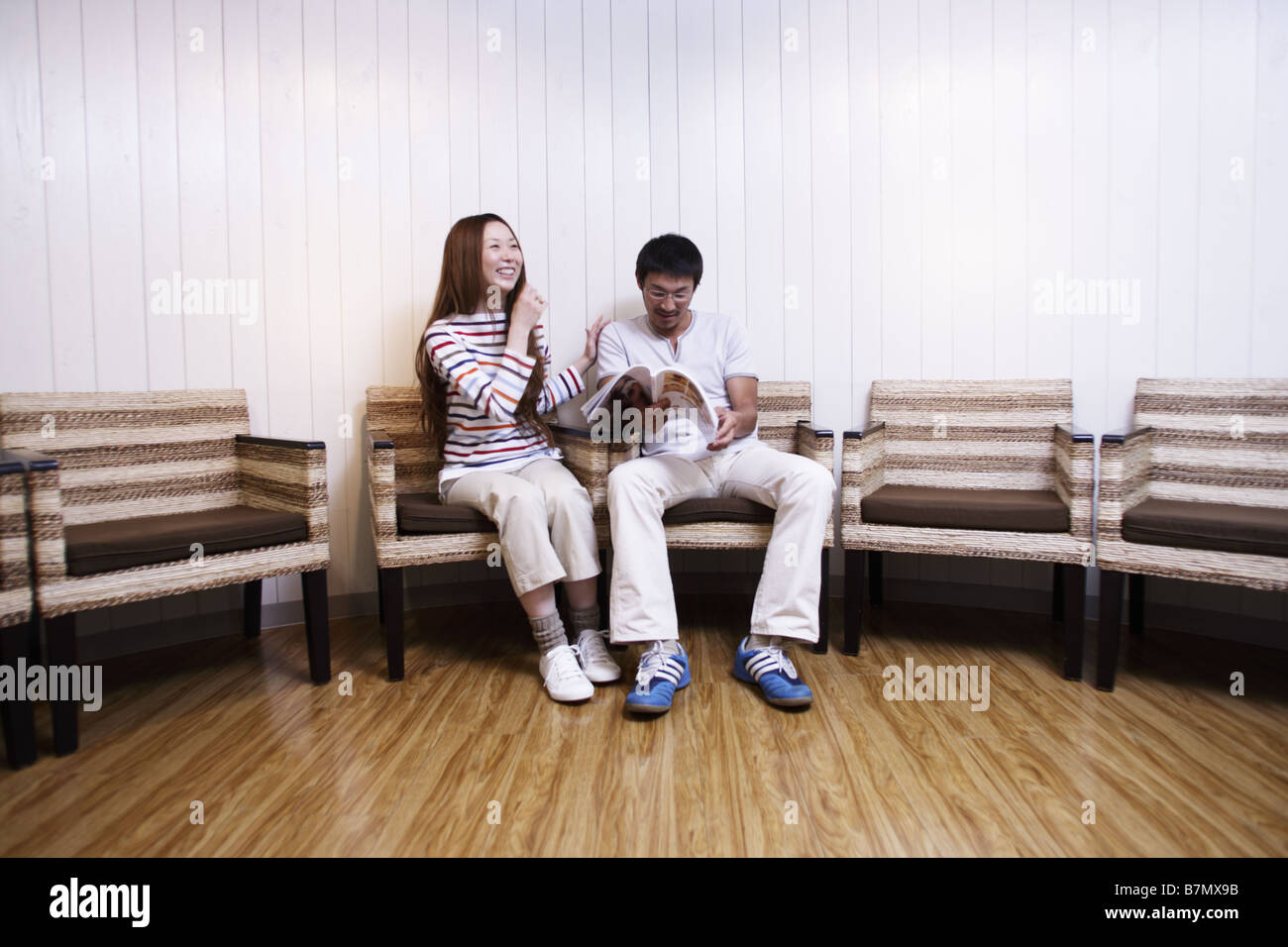 Couple in Waiting Room Stock Photo - Alamy