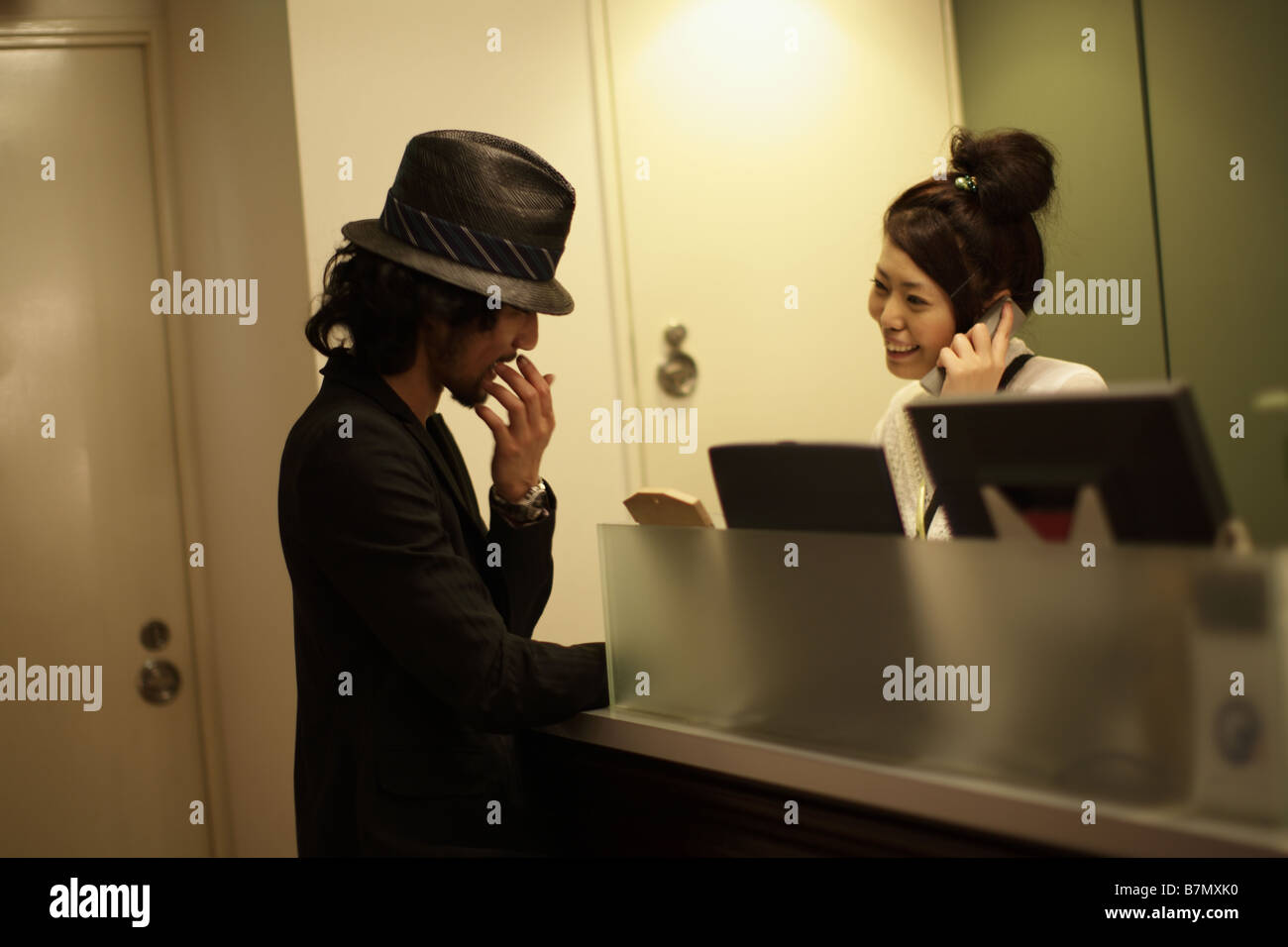 Hairstylists Standing at Reception Desk in Hairsalon Stock Photo - Alamy