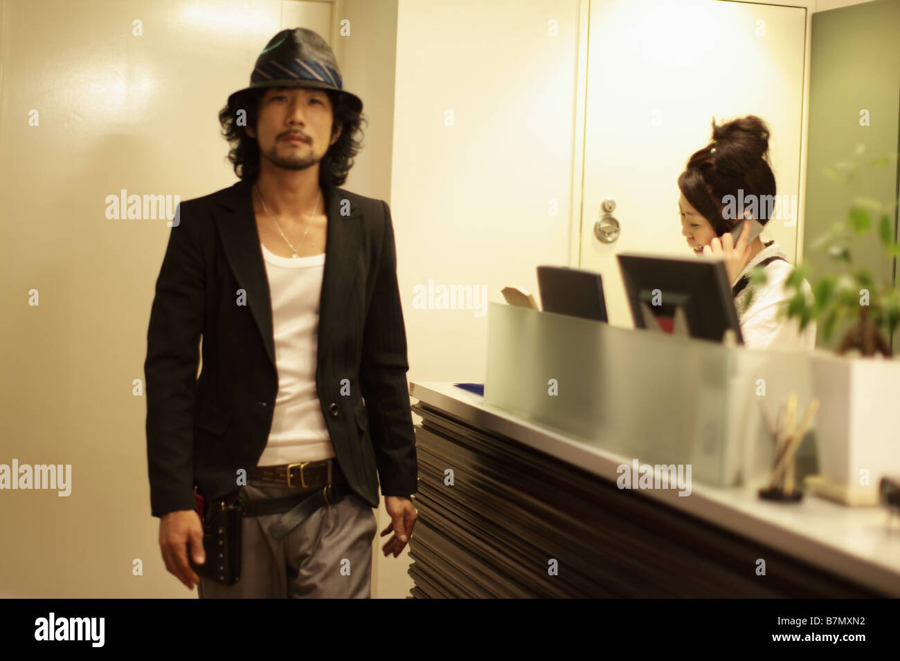 Hairstylists Standing at Reception Desk in Hairsalon Stock Photo - Alamy