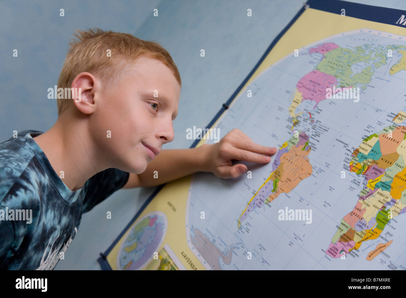 Teenage Boy Studying World Map Stock Photo - Alamy