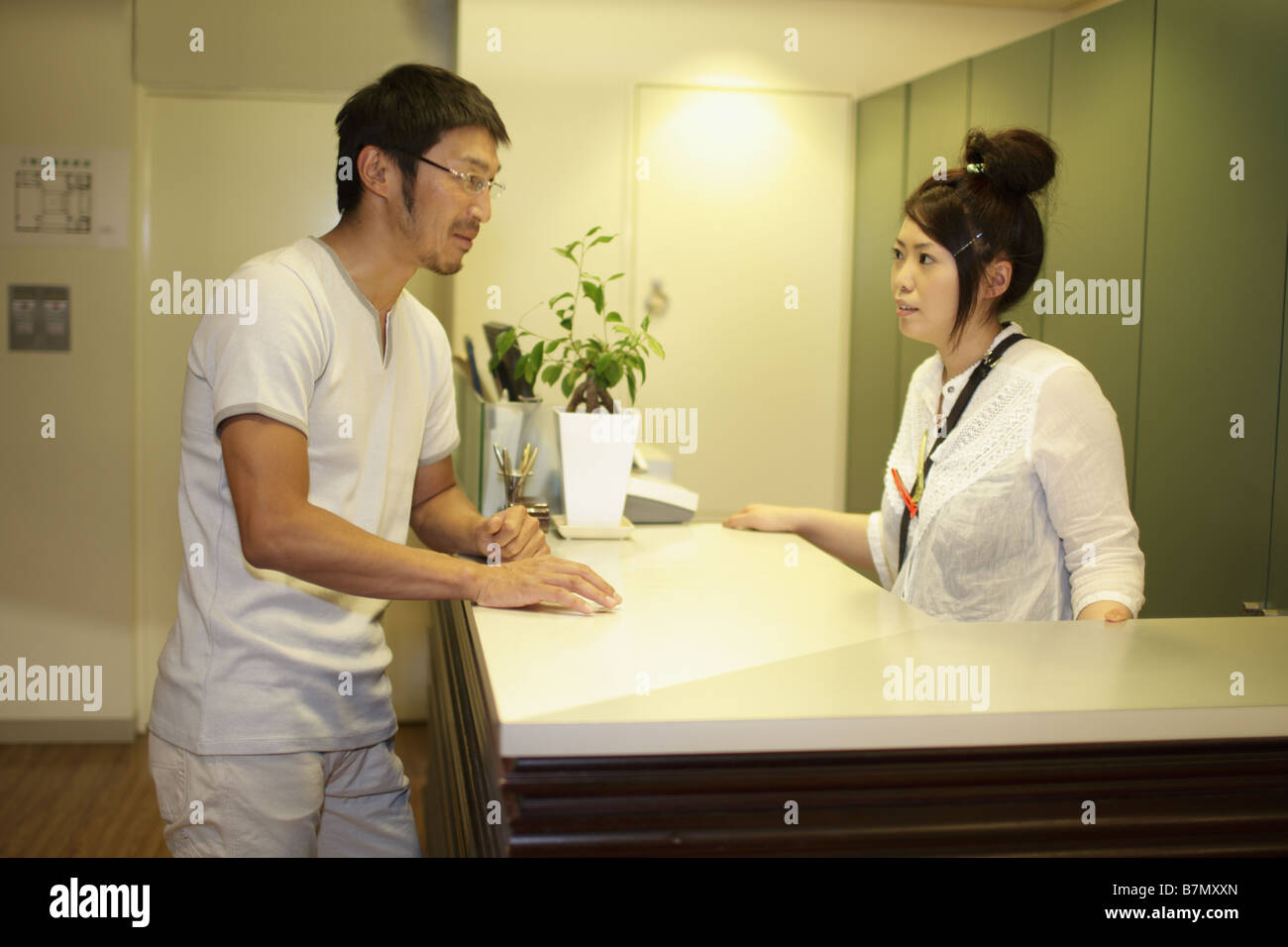 Reception man in white hi-res stock photography and images - Alamy