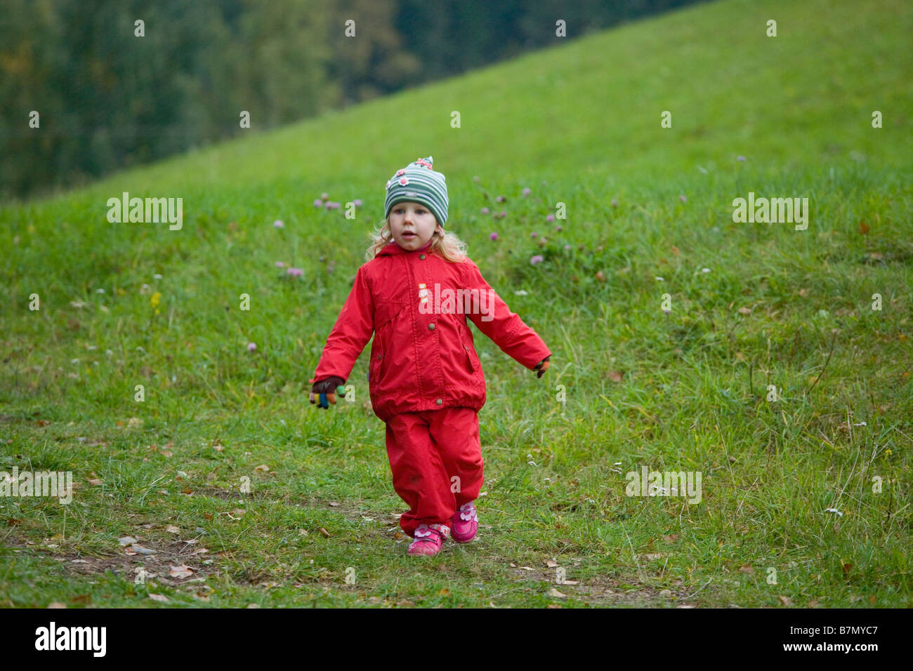 Two Year Old Girl Running in Meadow Stock Photo - Alamy