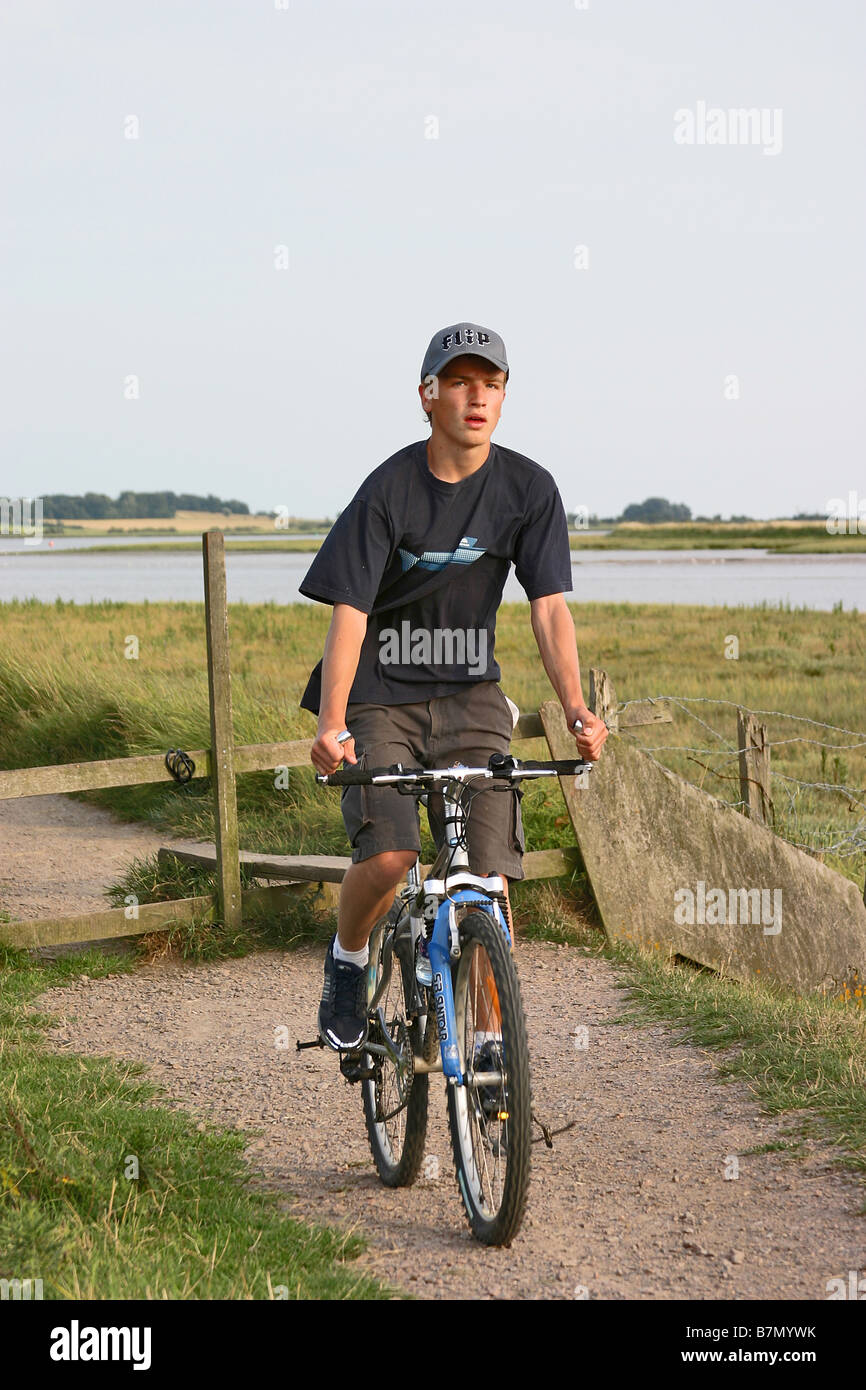 Boy riding bike Stock Photo - Alamy
