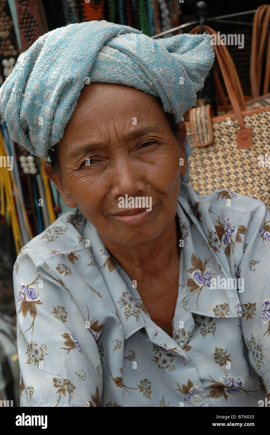 A stall owner at a market in Ubud, Bali poses for the camera Stock ...