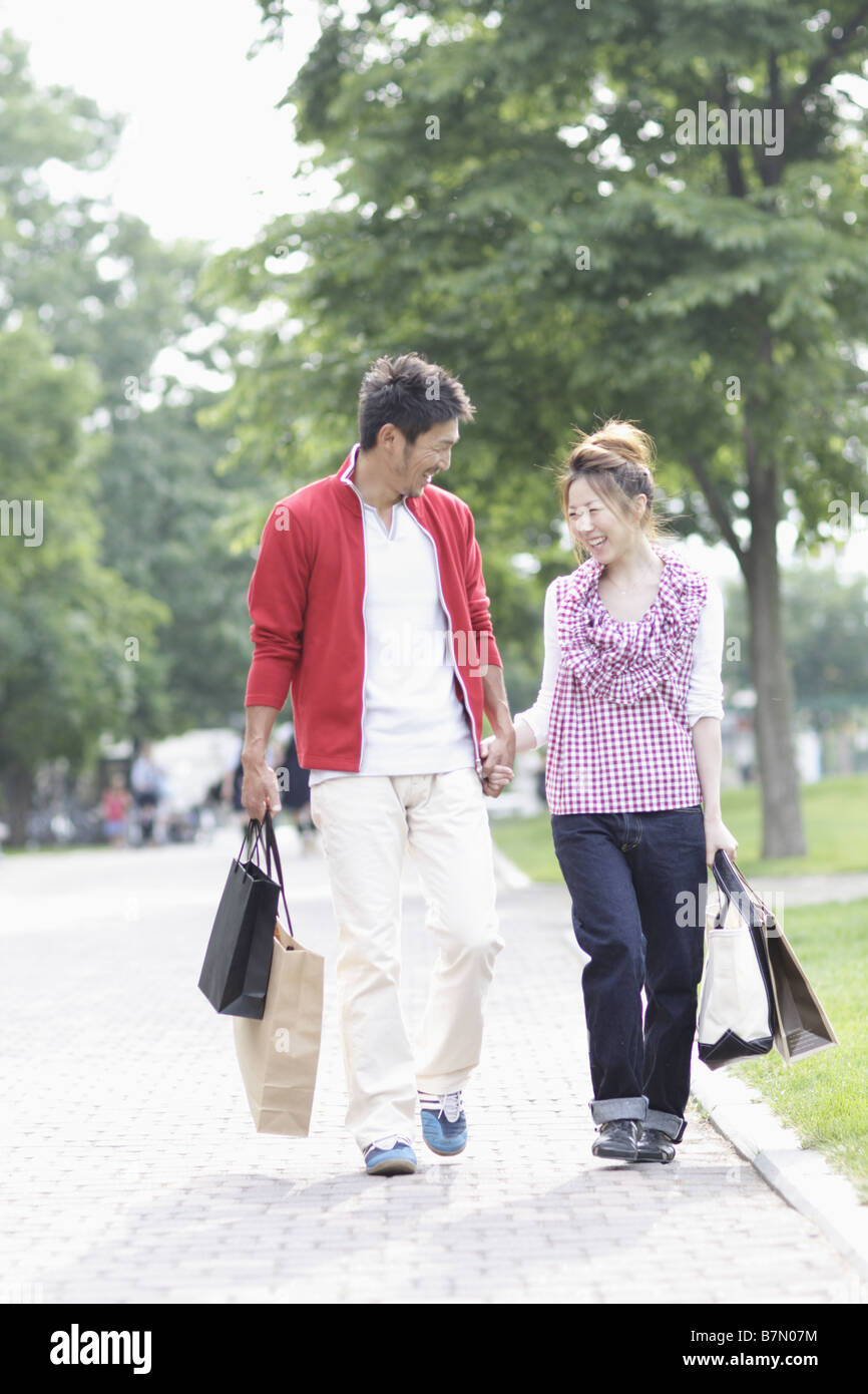 Smiling Couple Walking Together Stock Photo - Alamy