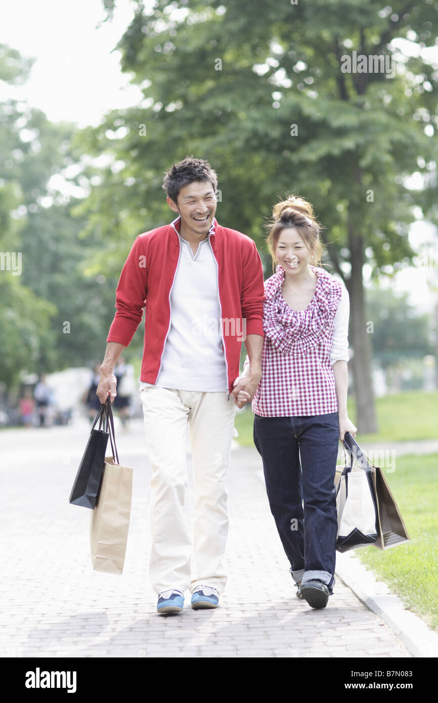 Smiling Couple Walking Together Stock Photo - Alamy