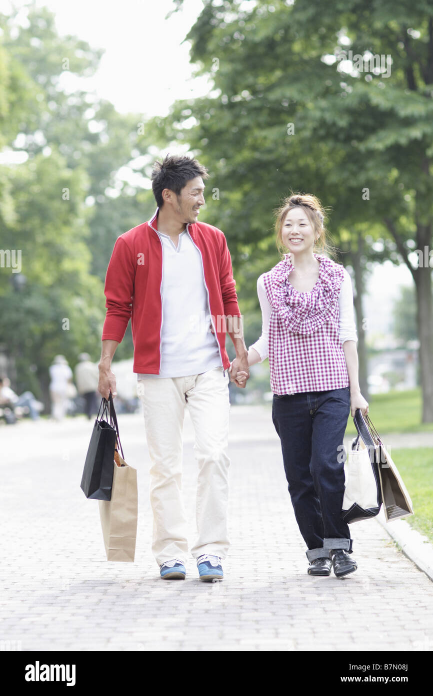 Smiling Couple Walking Together Stock Photo - Alamy