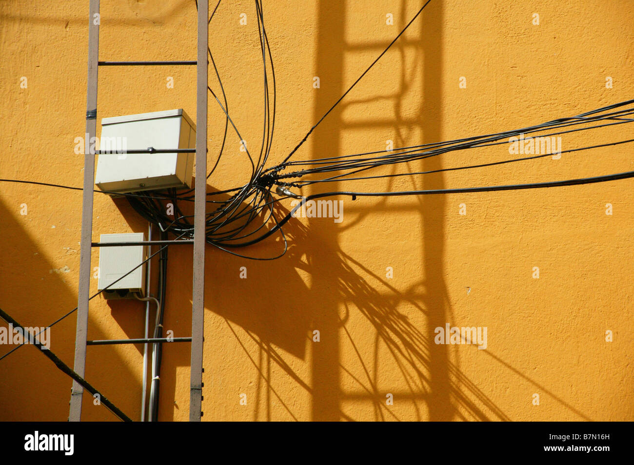 Blastered Wall, Telephone Wires Stock Photo - Alamy