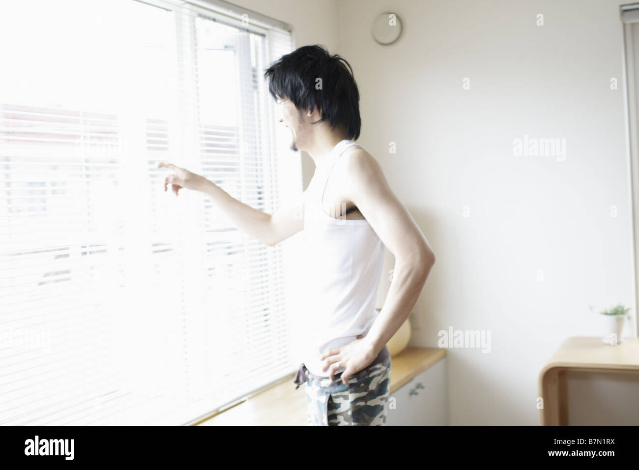 Man Looking Through Window Stock Photo - Alamy