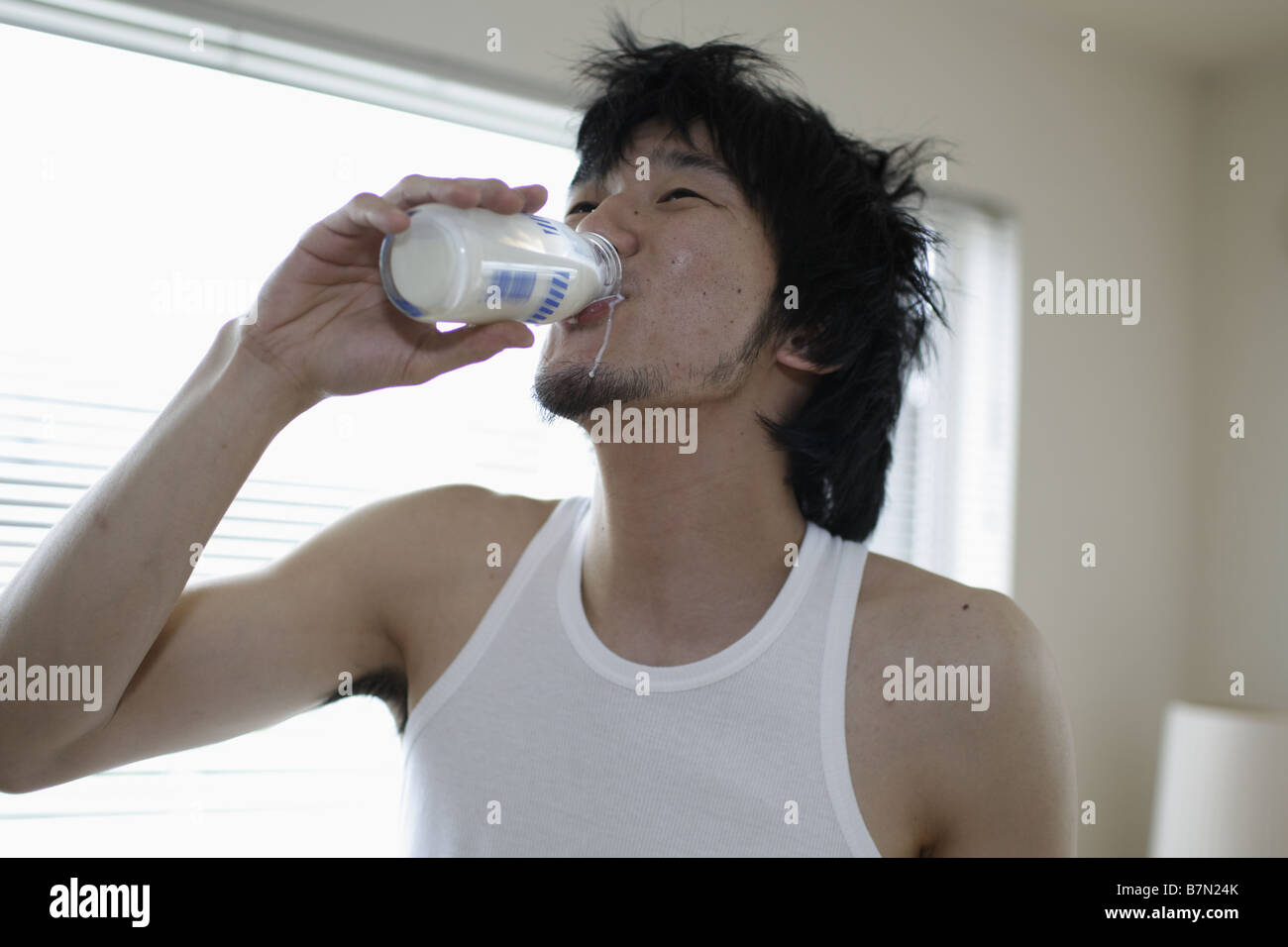 Man Drinking a Milk Stock Photo - Alamy
