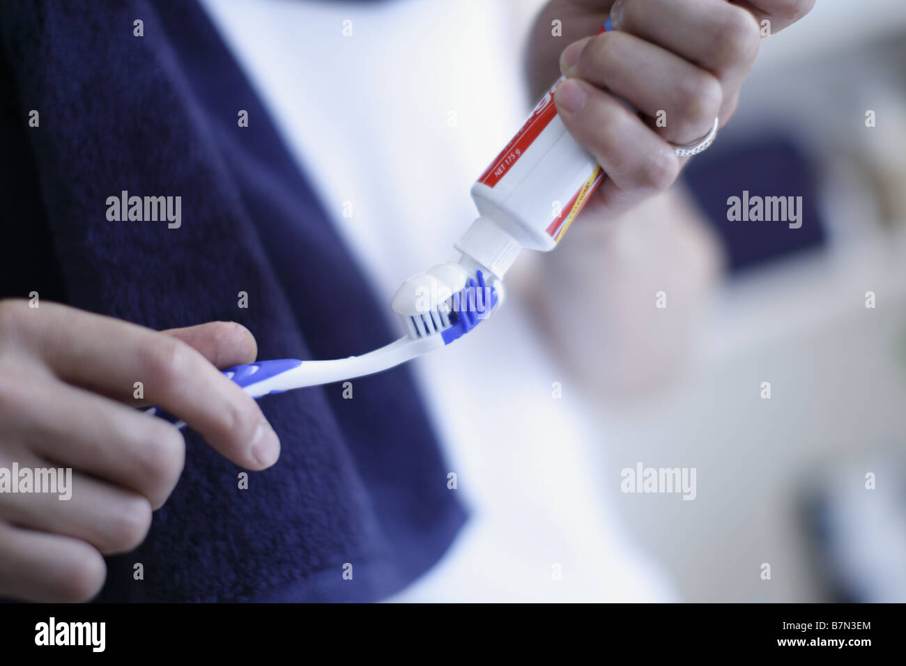 Man putting toothpaste on toothbrush hi-res stock photography and ...