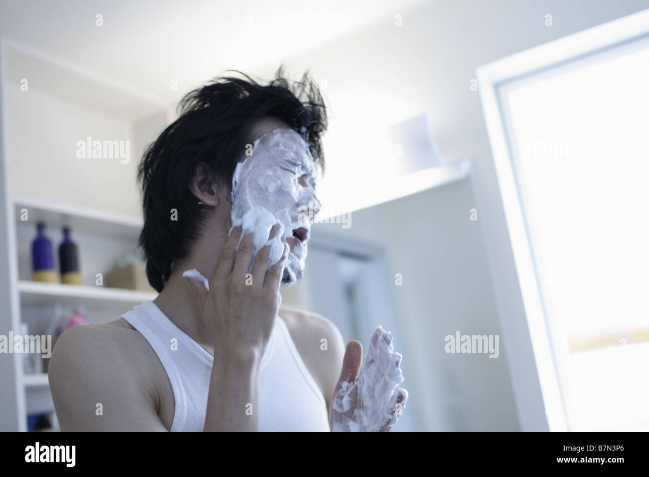 Man Washing His Face in a Bathroom Stock Photo - Alamy