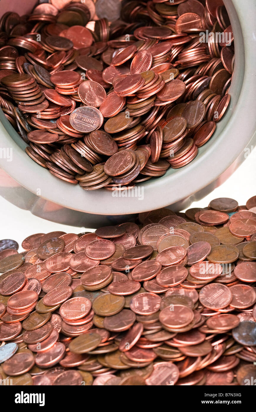 A bowl of pennies on a white background Stock Photo - Alamy