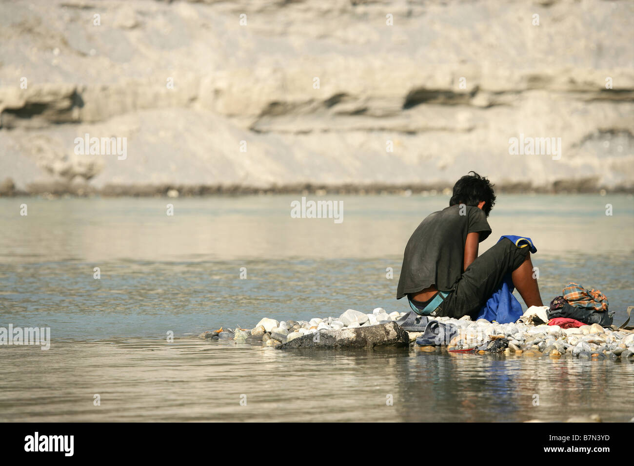 Man washing clothes Seti River Stock Photo - Alamy