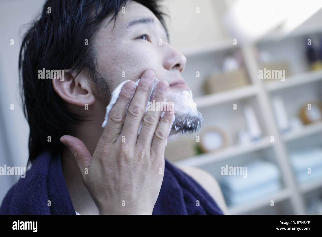 Man Shaving in a Bathroom Stock Photo - Alamy