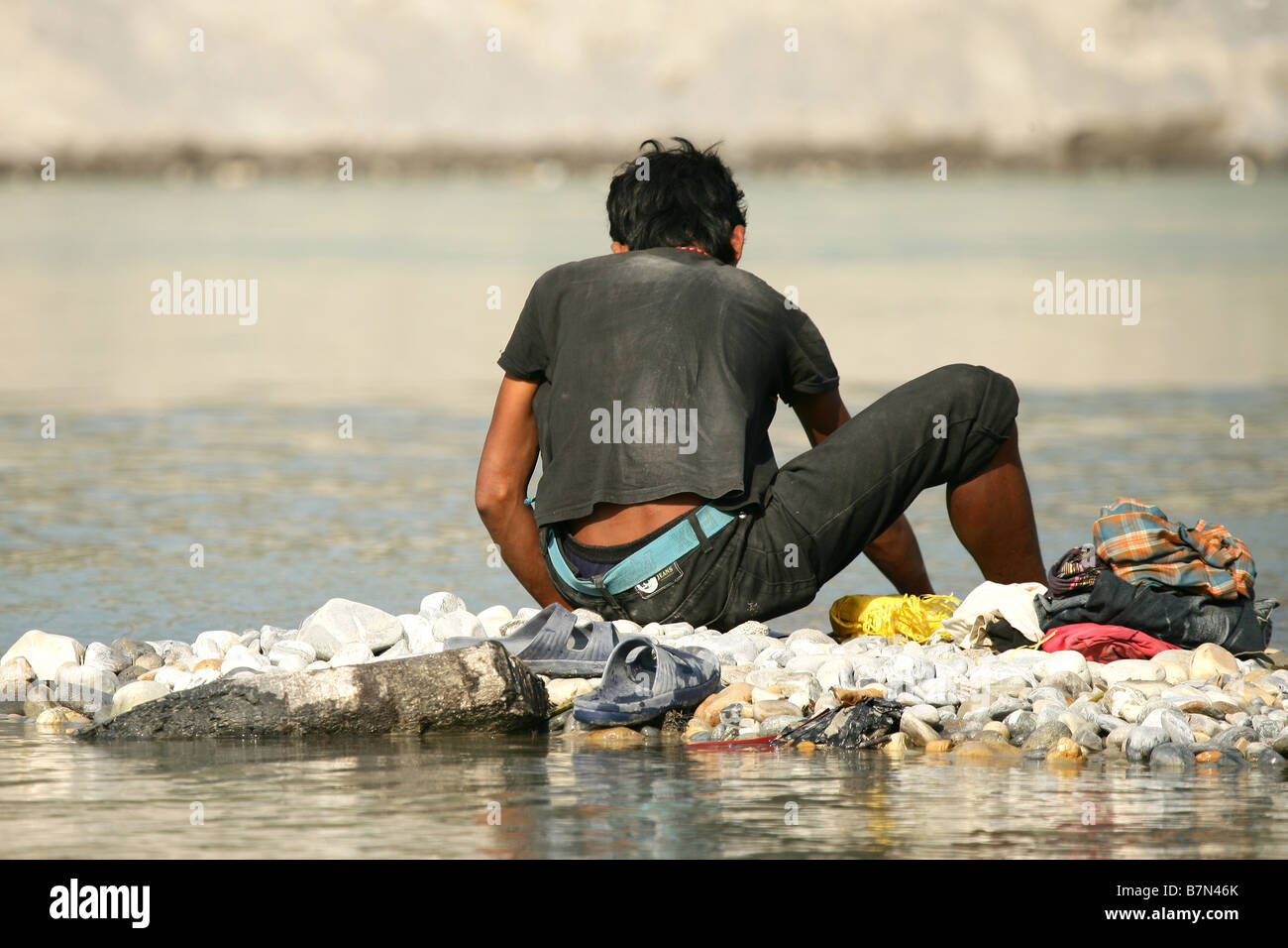 Man washing clothes Seti River Stock Photo - Alamy