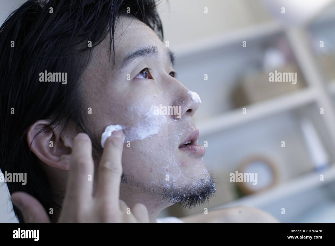 Man Applying Facial Cream Stock Photo - Alamy