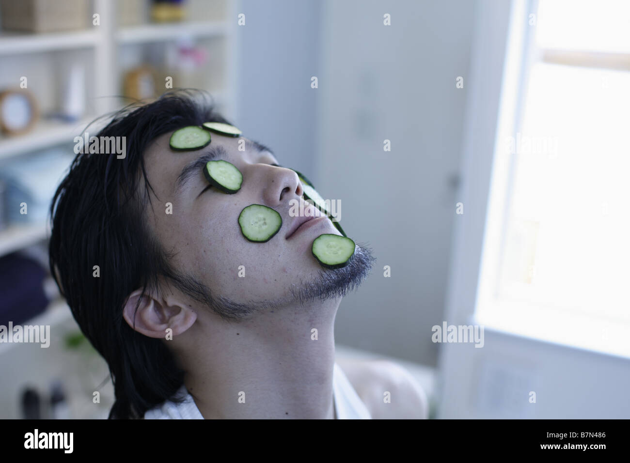 Man with Cucumber Slices On His Face Stock Photo - Alamy