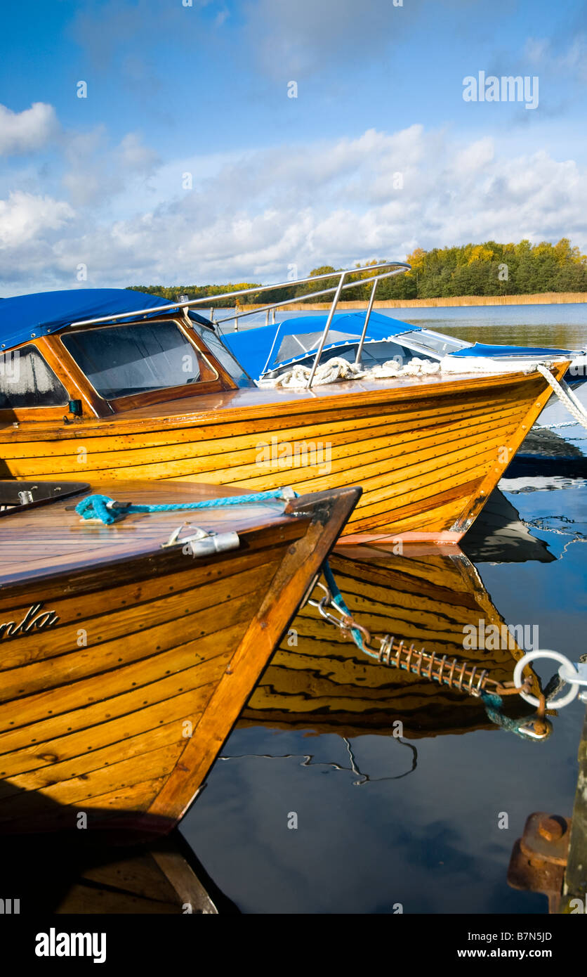 Boats and their reflection in the water Stock Photo - Alamy