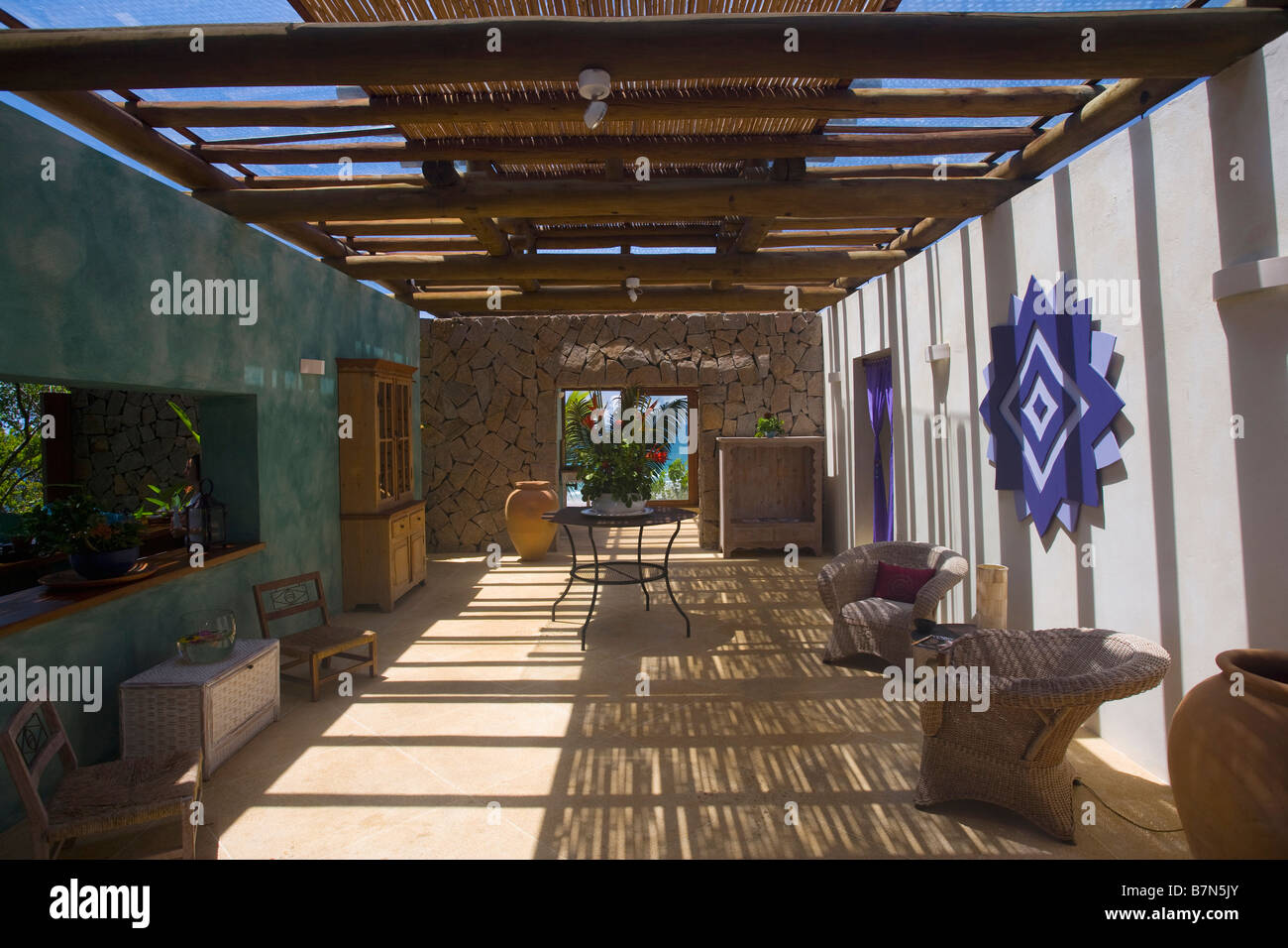 Shaded living area on veranda of rustic Brazilian beach house Stock ...