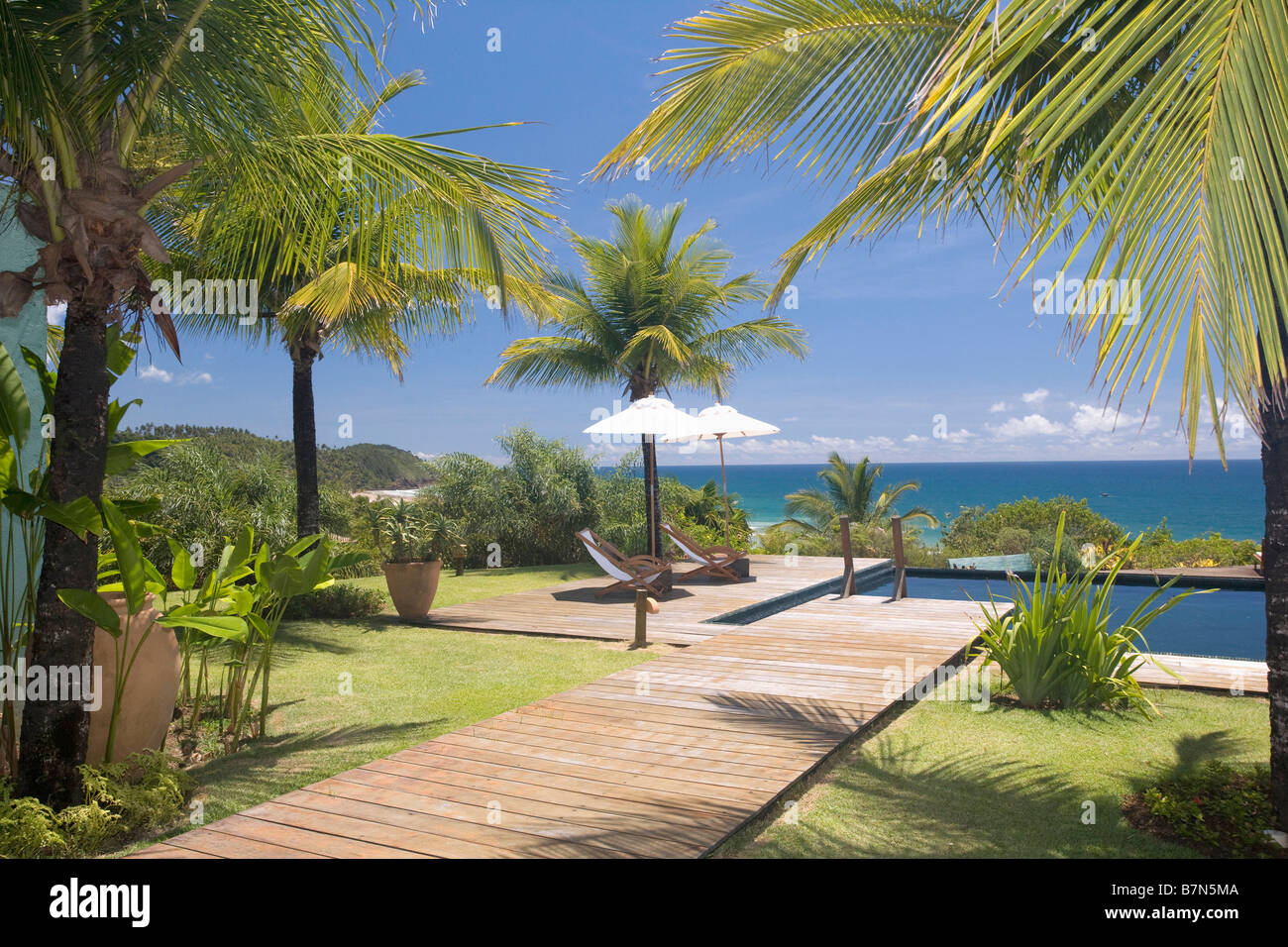 Decking path to swimming pool by the sea in Brazil Stock Photo - Alamy