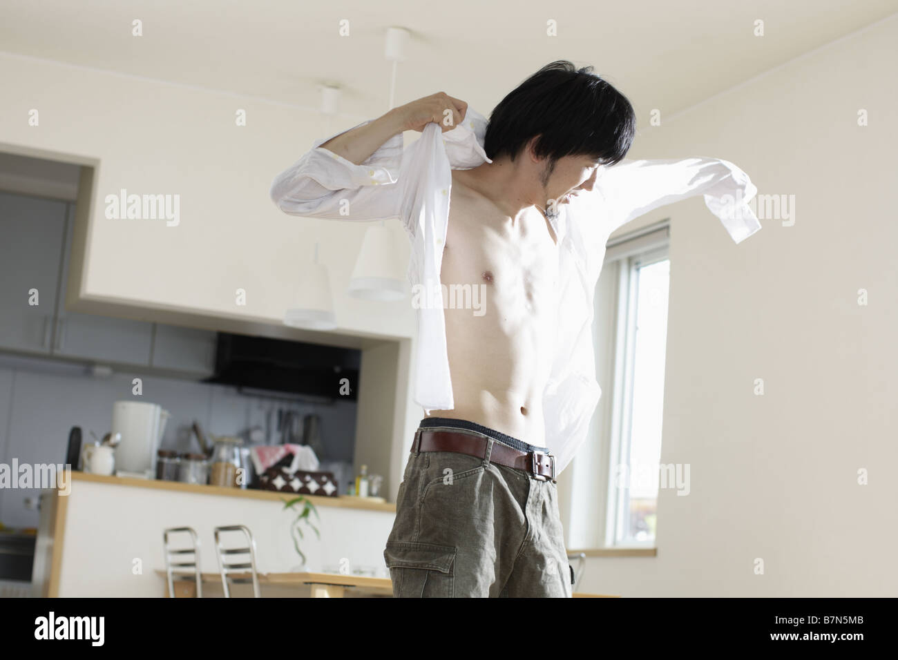 Man Getting Dressed Stock Photo - Alamy
