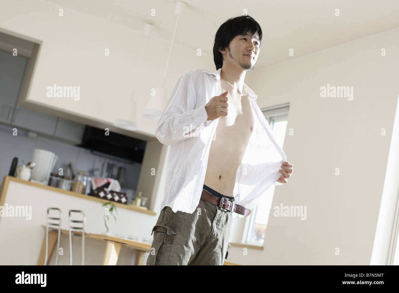 Man Getting Dressed Stock Photo - Alamy