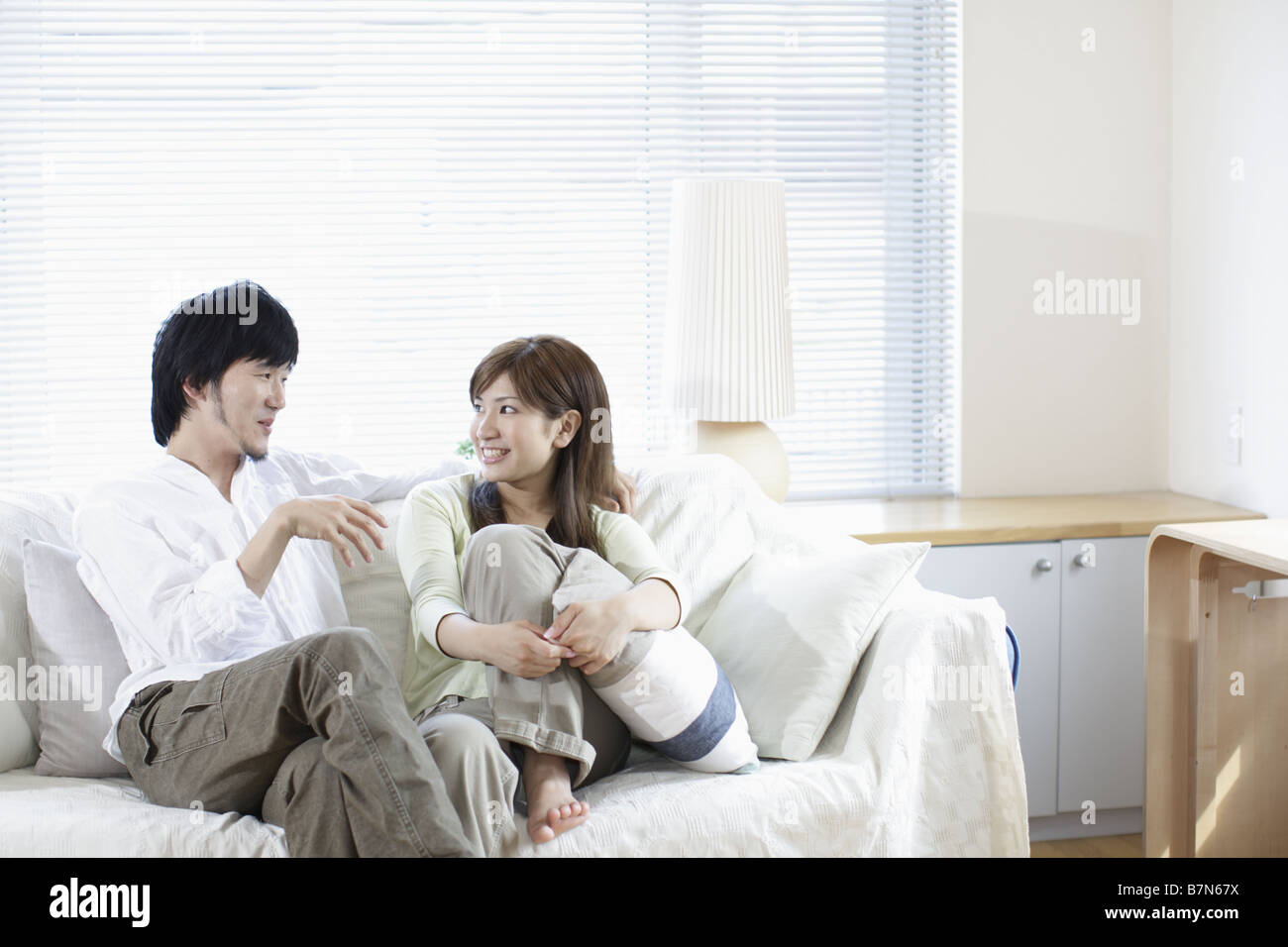 Couple Talking in Home Stock Photo - Alamy