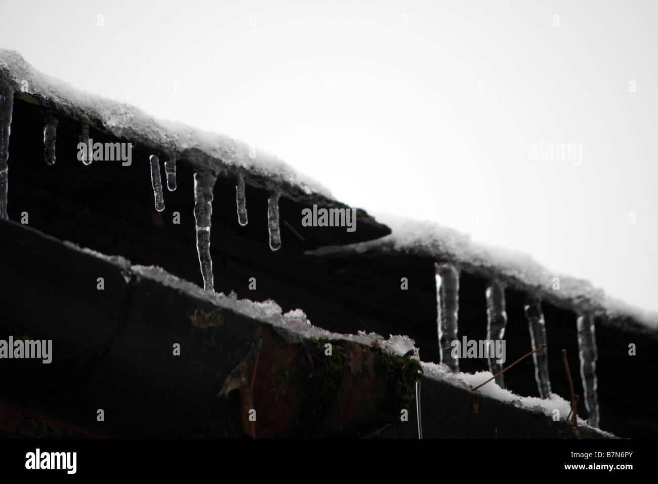 Dripping icles on a rooftop Stock Photo - Alamy