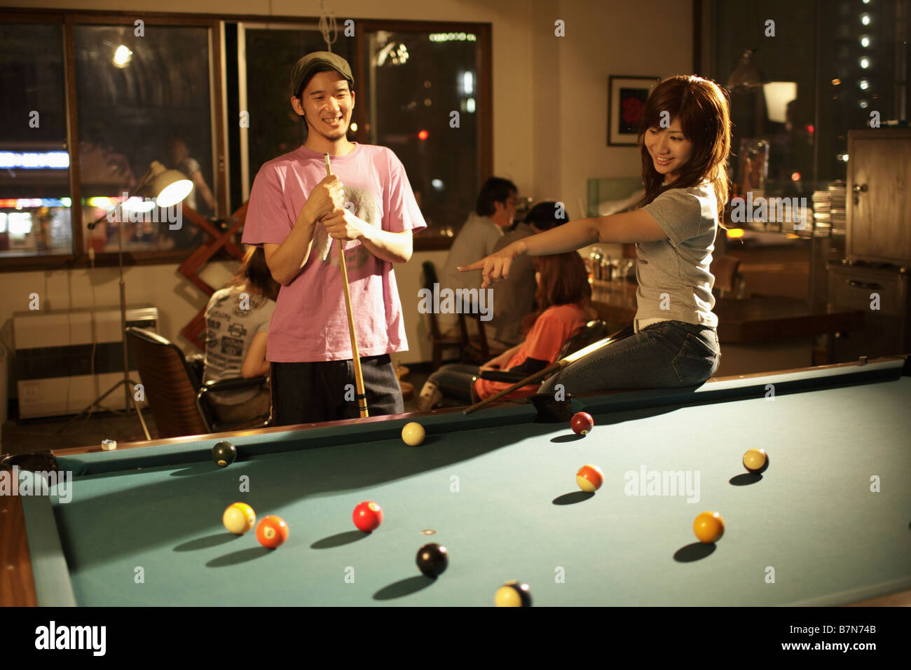Couple Playing Pool Stock Photo - Alamy
